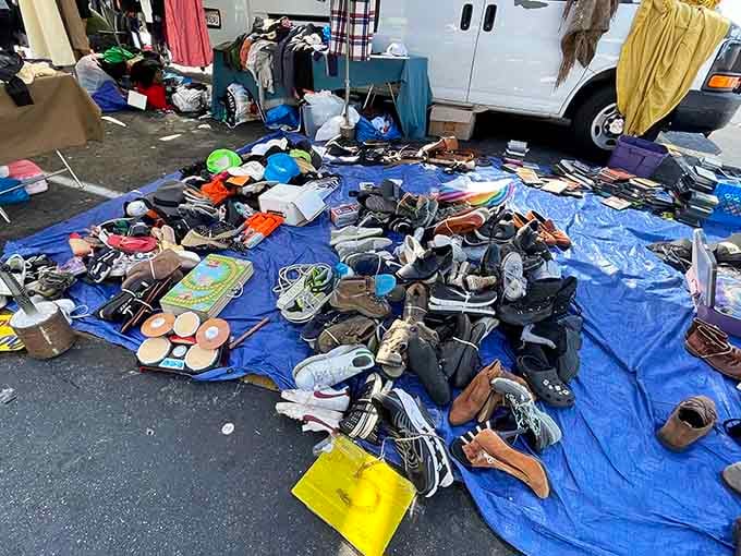 Footwear sprawled on tarps like a shoe lover's fever dream, where bargains literally lie at your feet.