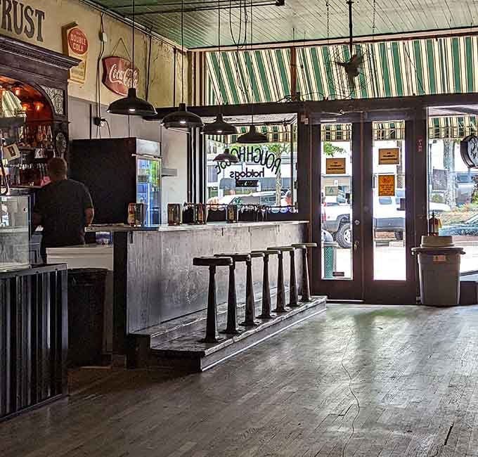 The counter and stools look like they've hosted a million conversations and twice as many hot dogs.