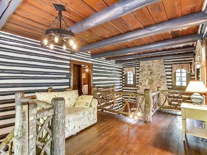 The loft seating area feels like a treehouse that grew up, got rustic furniture, and never looked back.