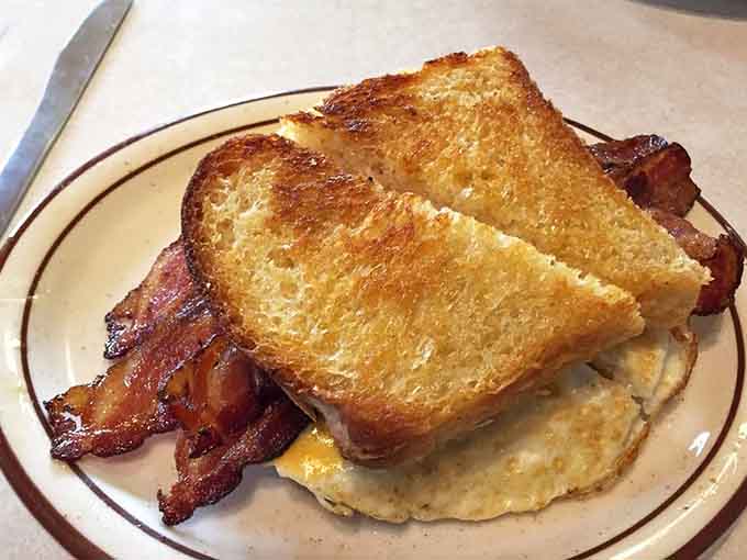 Crispy bacon, golden toast, and a perfectly cooked egg, proof that breakfast simplicity is its own kind of genius.