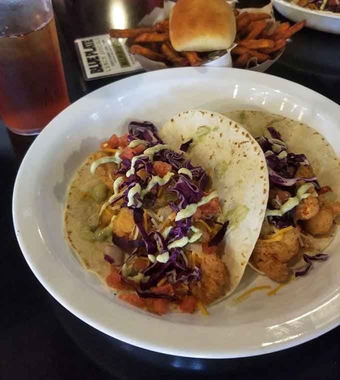 Shrimp tacos loaded with purple cabbage, pico, and creamy drizzle, proof that The Wicked Wheel knows its way around a tortilla.