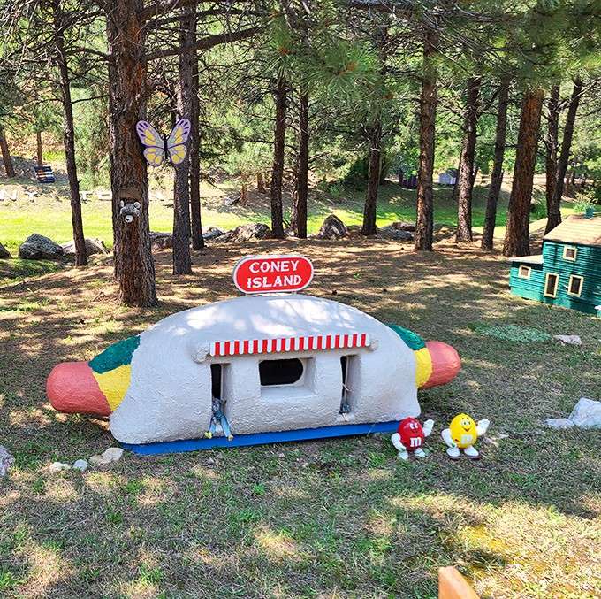 A hot dog-shaped Coney Island stand flanked by M&M characters is the kind of fever dream that makes total sense here.