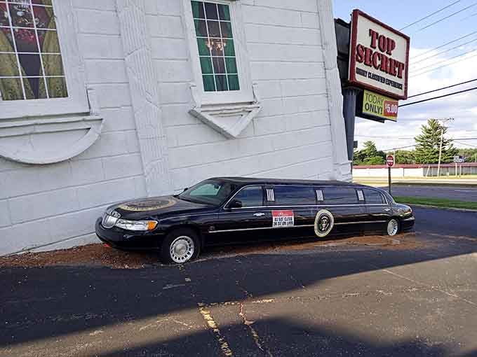 A presidential stretch limousine parked against a tilting building is the most Wisconsin Dells thing imaginable.