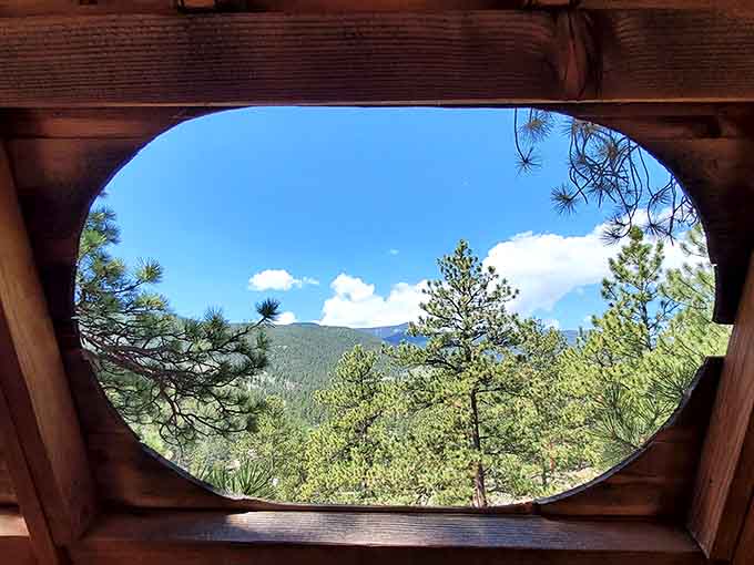 That oval window frames the kind of Colorado mountain view that makes you want to cancel all your plans indefinitely.