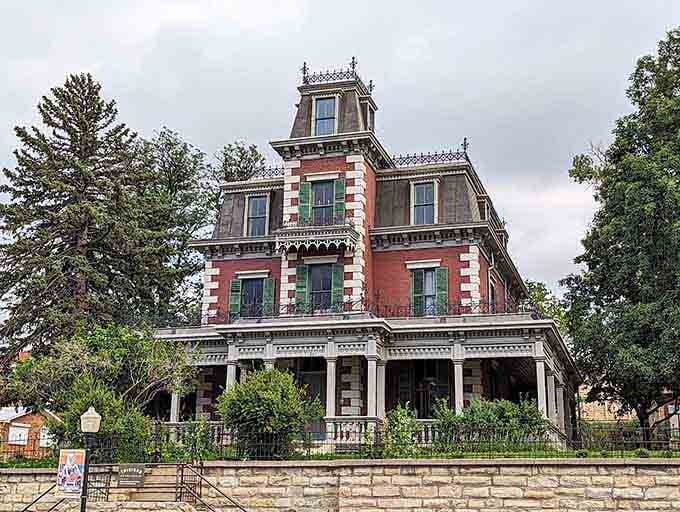 The Bloom Mansion stands tall and dramatic, like Victorian architecture decided to make a serious statement.