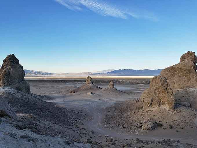 Standing between the spires, with the dry lake bed stretching out behind them, feels genuinely cinematic and a little humbling.