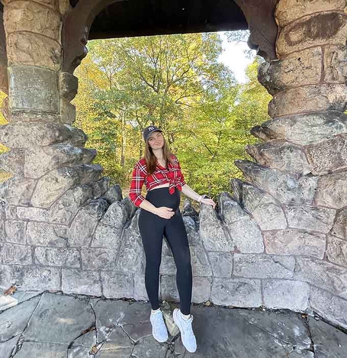 The stone archway makes the perfect frame. The forest behind it does the rest of the work entirely on its own.