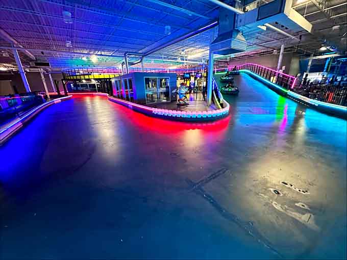 The go-kart track glows under rainbow lights, making every lap feel like a victory lap worth celebrating loudly.