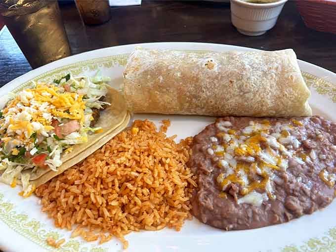 A burrito and taco sharing a plate: two classics, one table, zero complaints from anyone in the vicinity.