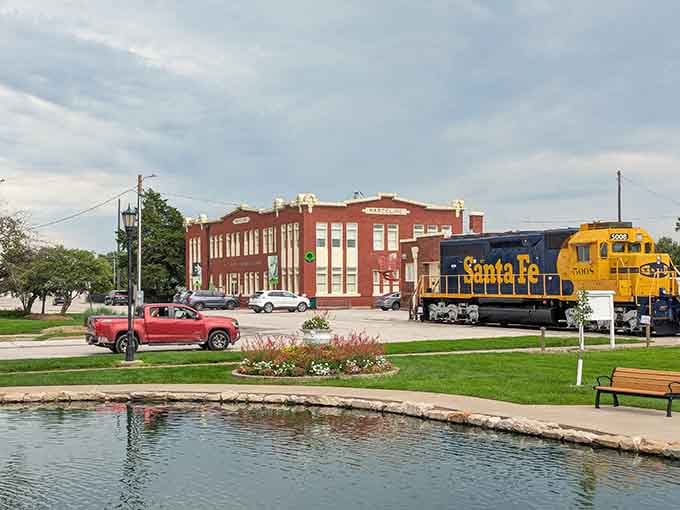 A vintage Santa Fe locomotive sits outside like a proud guardian, reminding you exactly why trains matter to this story.