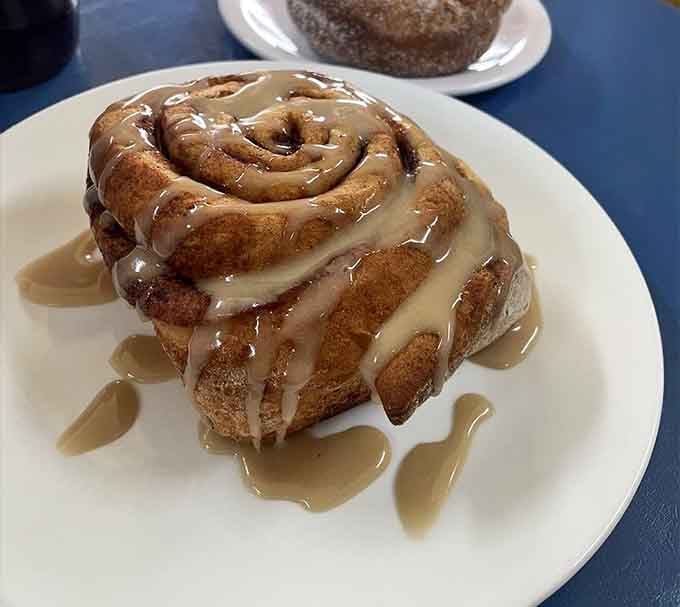 That cinnamon roll drowning in glaze is not subtle, and honestly, it shouldn't be. Pure, unapologetic morning joy.