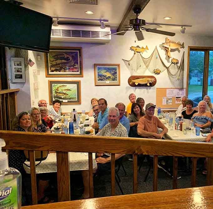 A full dining room of happy faces, because great fish fry has always been a team sport.