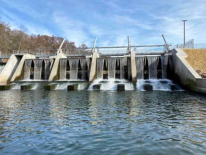 Water pushes steadily through the concrete gates of the park dam, a reminder that even tamed rivers have something powerful to say.