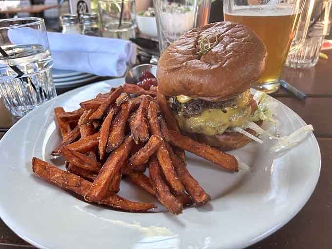 A proper smash burger on brioche with sweet potato fries alongside. Simple, honest, and absolutely worth every single bite.