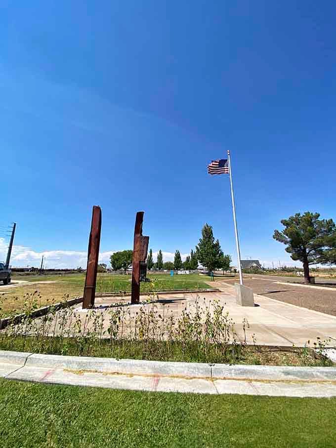 A quiet memorial under an open Arizona sky, where the flag flies proud and the silence says everything.