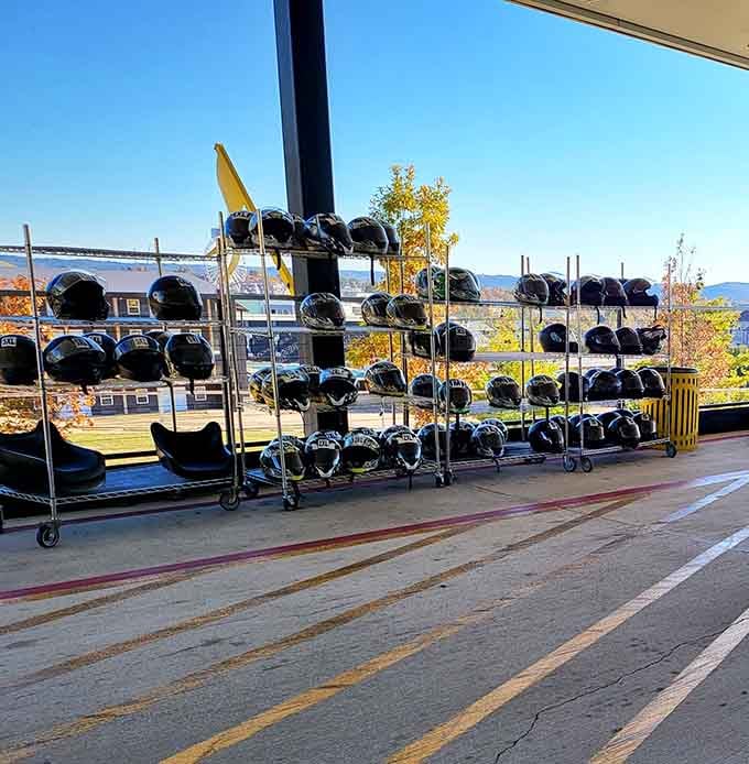 Rows of helmets waiting patiently, like a very serious hat collection that actually serves a purpose out here.