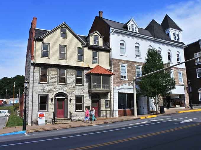 Stone and brick buildings line streets where history isn't just preserved but actually lived every day.