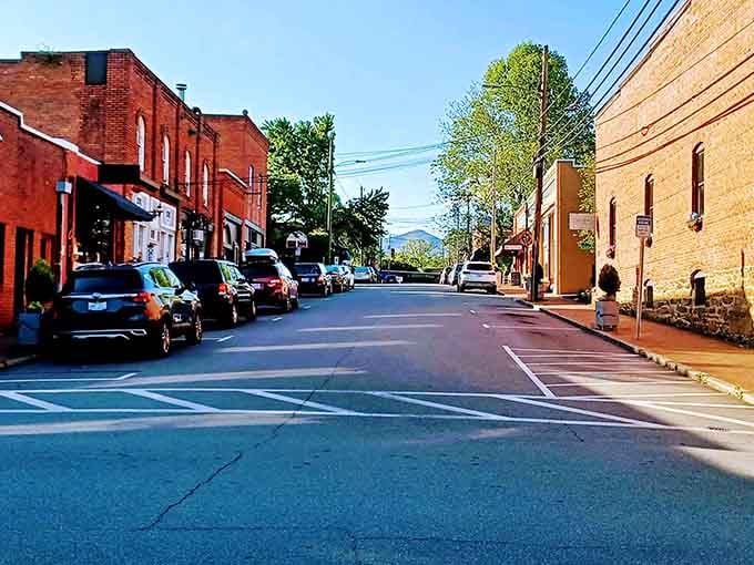 Black Mountain's brick-lined street glows golden, with the Blue Ridge Mountains keeping a watchful eye above.