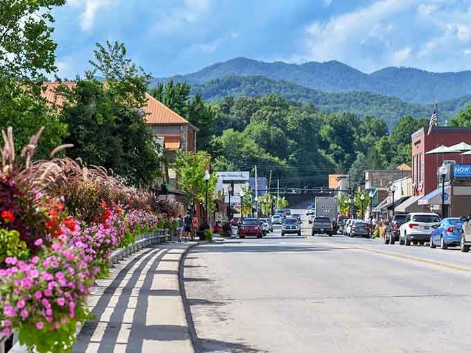 Pink flowers frame the main street while those mountains rise up behind like protective guardians of tradition.