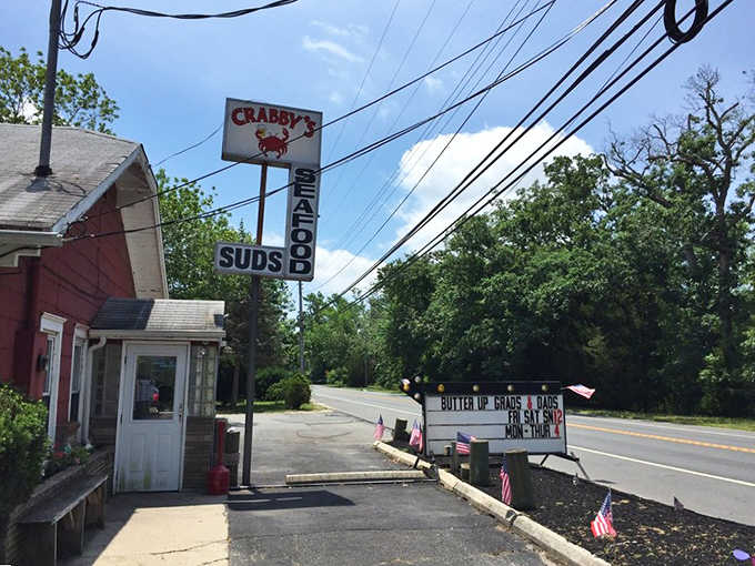 That cheerful cartoon crab on the roadside sign, paired with a marquee greeting grads and dads, is small-town charm at its finest.
