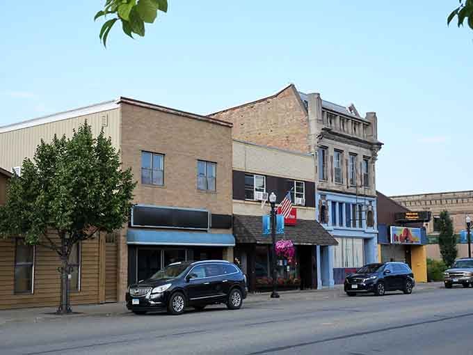 International Falls at golden hour feels quietly determined, the American flag catching a breeze above storefronts that have clearly weathered a few serious winters with dignity.