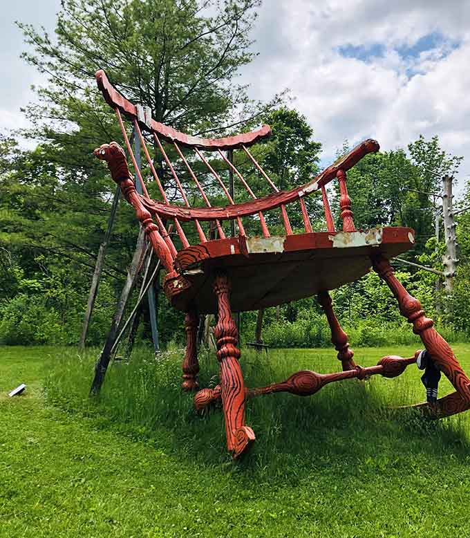 This oversized crimson chair sculpture towers over the meadow, inviting giants to sit and stay awhile for tea.
