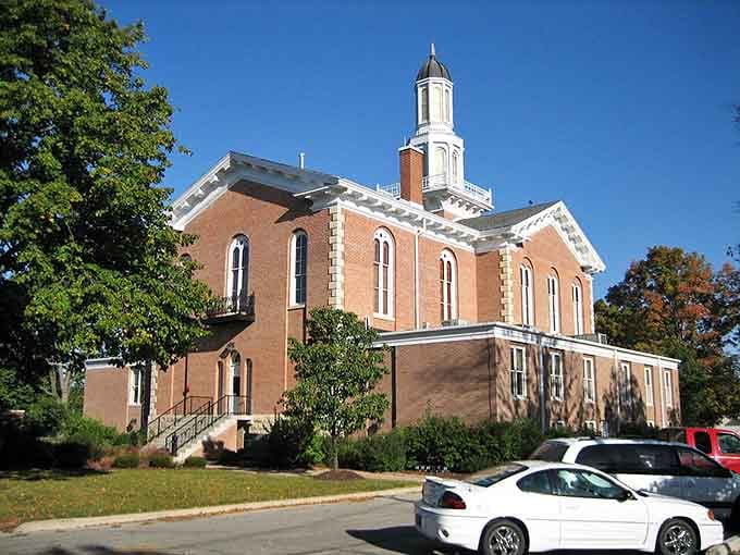 Pale brick, arched windows, and a white cupola gleaming in the sun, this Elgin landmark has the kind of dignity that only time can build.