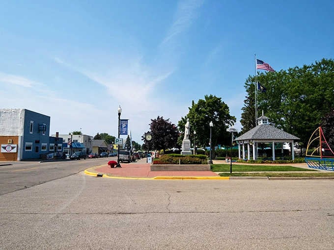 Caseville's town square gazebo stands proudly beside manicured gardens and a waving American flag, the kind of scene that makes you genuinely proud of small-town Michigan.
