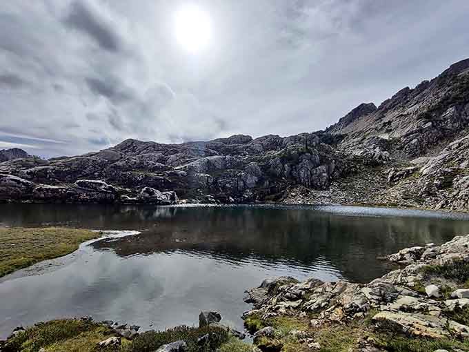 Clouds drift above a moody Gothic Basin lake, the whole scene feeling like a painting that earned its frame.