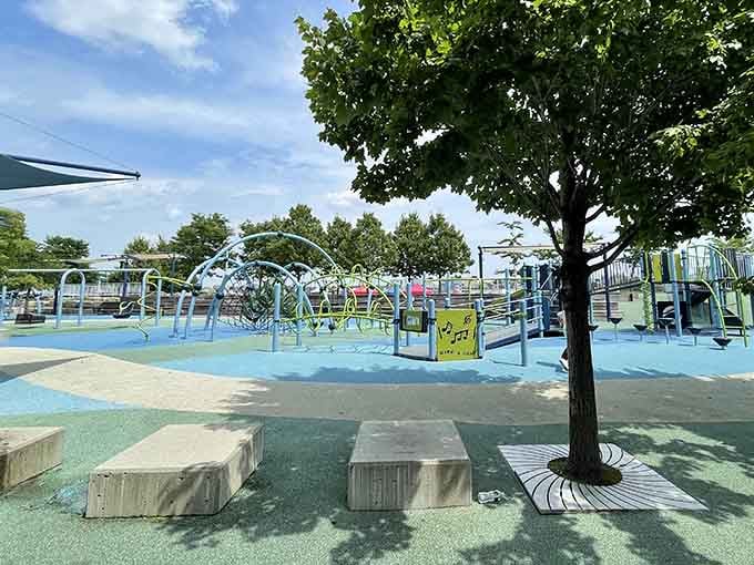 Shaded seating and colorful climbing structures create the perfect urban playground retreat for energetic grandkids.