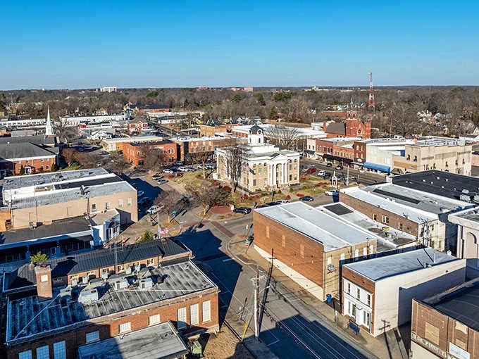 From this bird's-eye view, the town spreads out like a patchwork quilt of rooftops, steeples, and tree-lined residential streets.