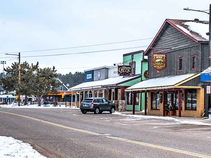 Winter's gentle touch transforms storefronts into a snow-dusted scene worthy of a Currier and Ives print.