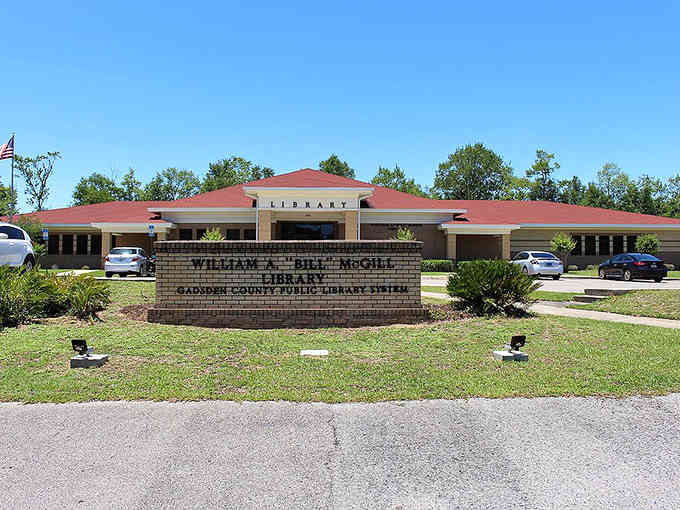 This modern library building proves small towns invest in education, with its welcoming entrance and well-maintained grounds inviting readers inside.
